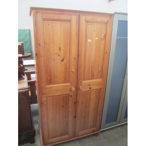 A 2 door pine wardrobe