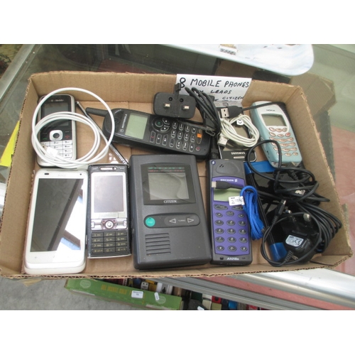 Box of assorted old mobile phones