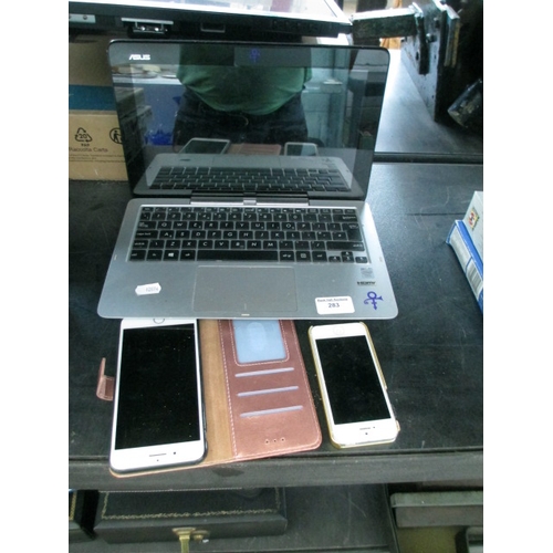 Asus notebook and two smart phones