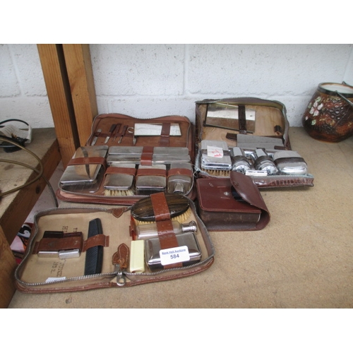 Four gentlemen's travel sets