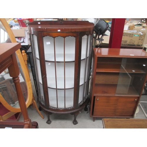 A vintage glazed bow front display cabinet on Ball and Claw legs