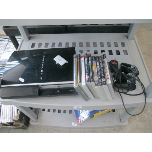 PS3 with games and controller