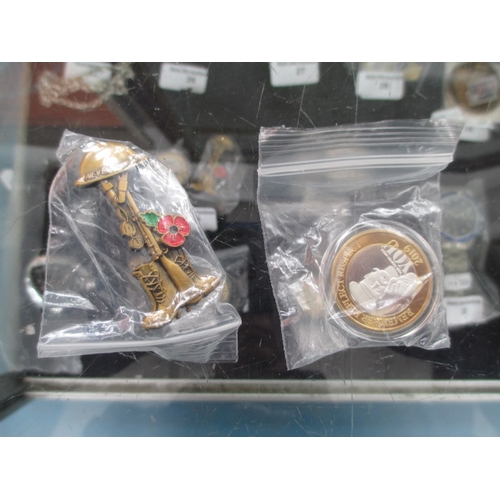 Commemorative Remember, Reflect, Respect coin and Never Forget badge