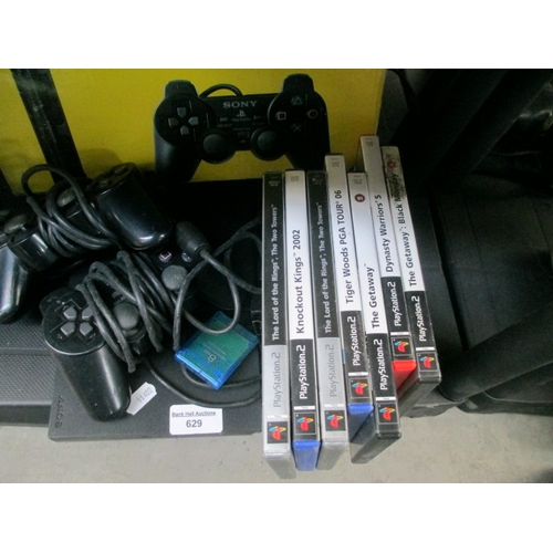 PS2 with controllers and games