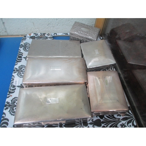 Six assorted white metal boxes