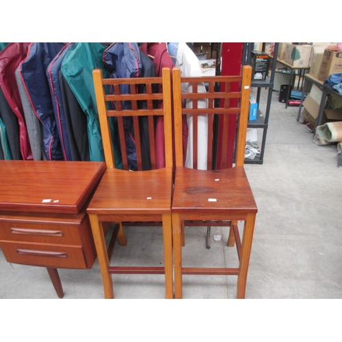 A pair of sturdy solid wooden stand chairs