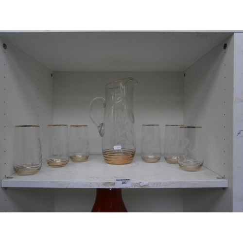 Decorative jug and six glasses