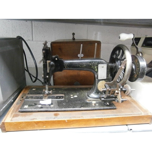 Vintage Frister & Rossmann sewing machine with inlaid wood case
