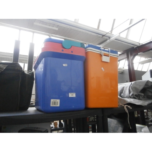 Two cooler boxes and ground sheet