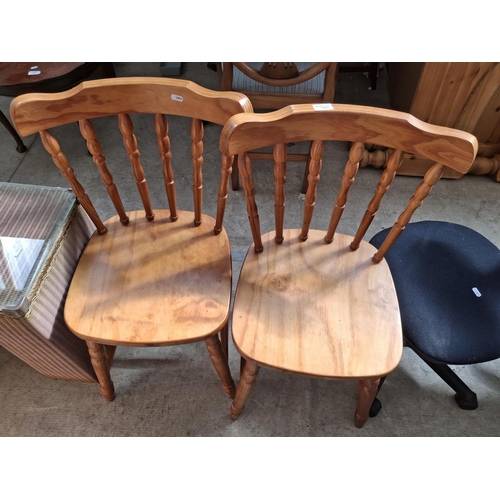 A pair of vintage pine kitchen chairs