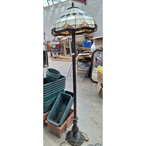 Decorative metal lamp with as found glass shade