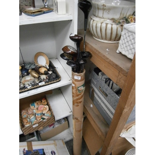 Seven assorted golf clubs