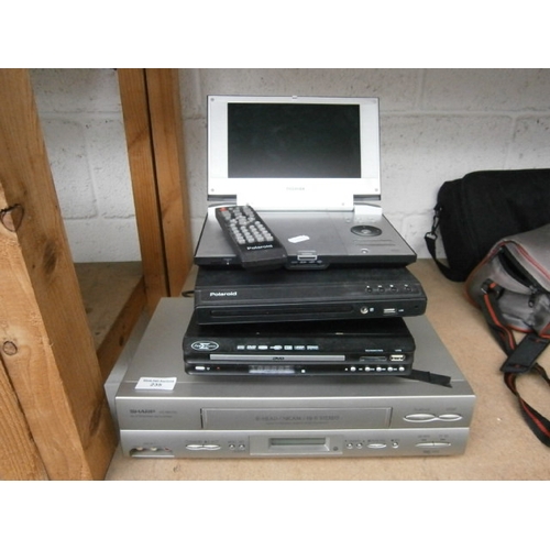 Lot inc Sharp VHS player, Toshiba portable DVD player, and two assorted ...