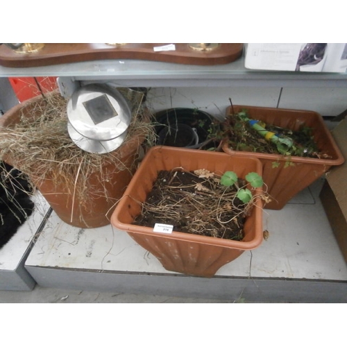 Four assorted plant pots