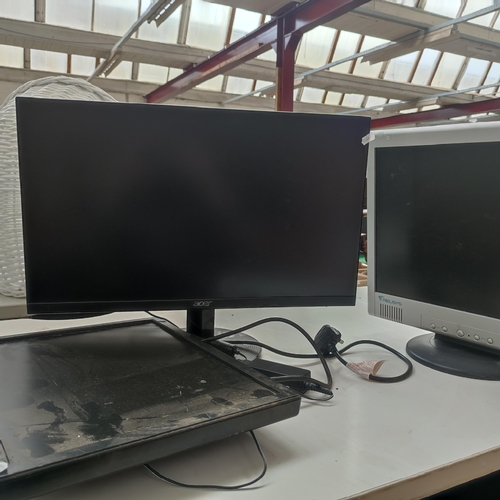 Five assorted computer monitors