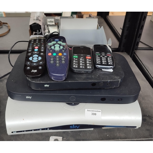 Three assorted Sky boxes and two phones