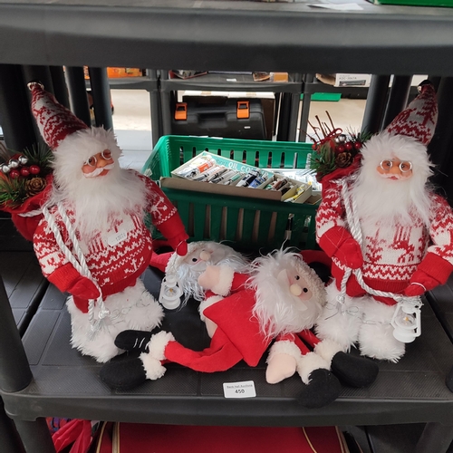 Four father Christmas ornaments
