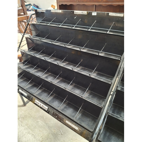 A large metal 5 tier CD retail display stand