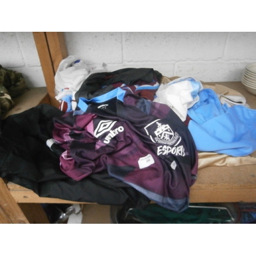 Selection of football shirts and shorts