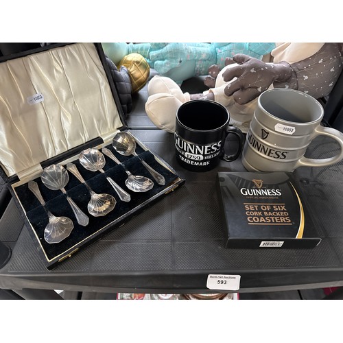 Two Guinness mugs, Guinness coasters and canteen of spoons