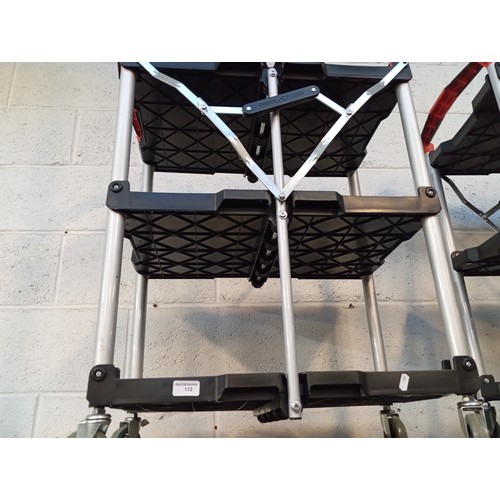 A small folding 3 tier trolley