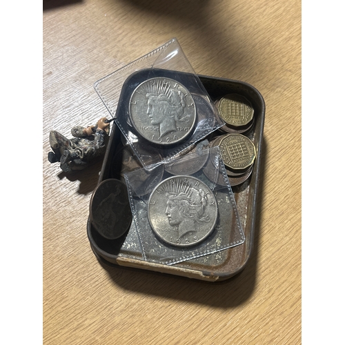 Tin of coins including figure