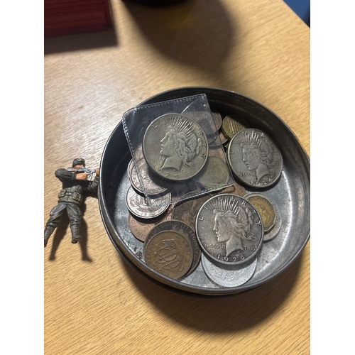 Tin of coins including figure