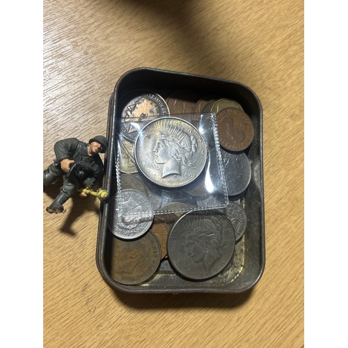 Tin of coins including figure