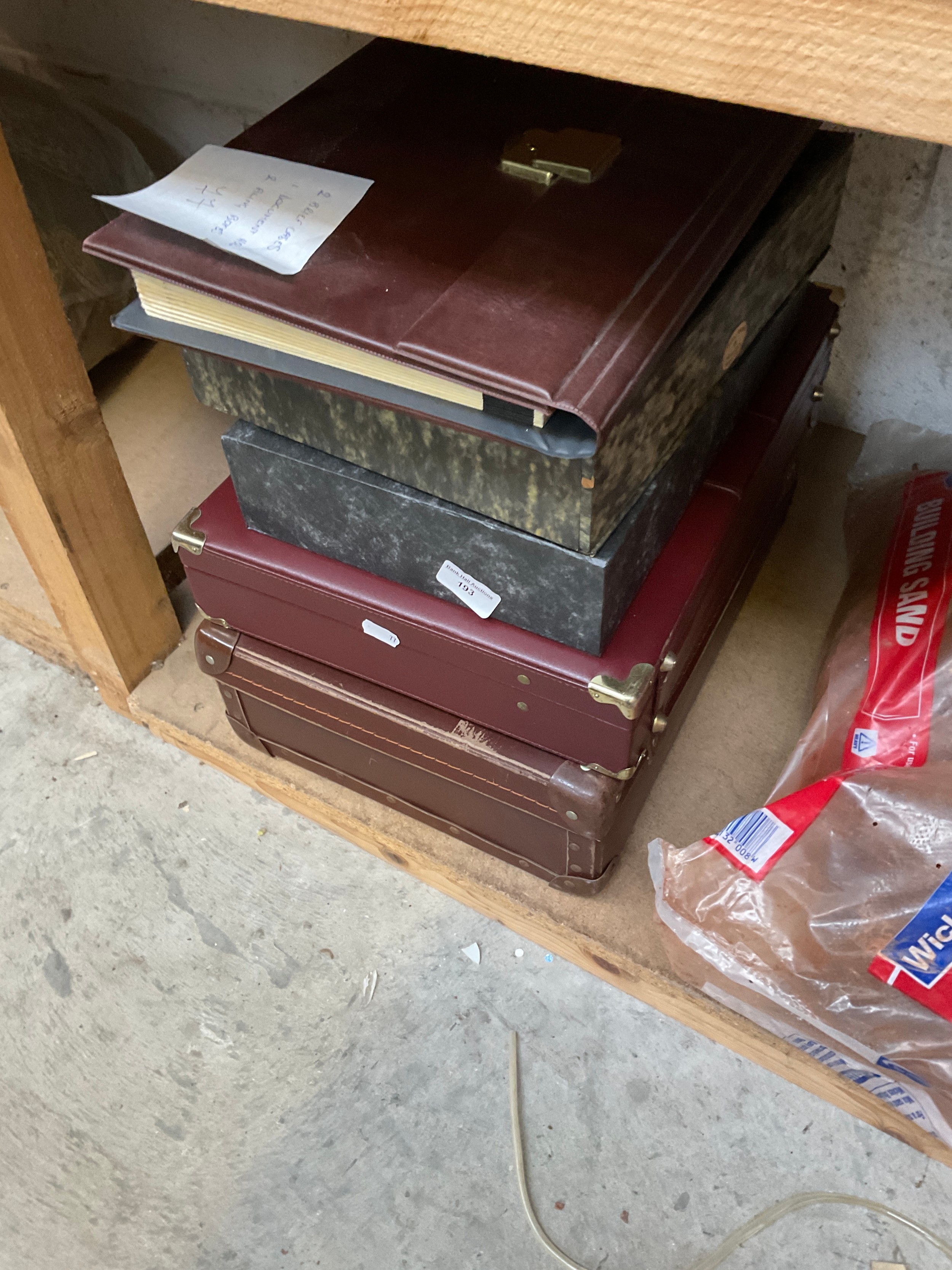 Two briefcases, two file boxes and document folder