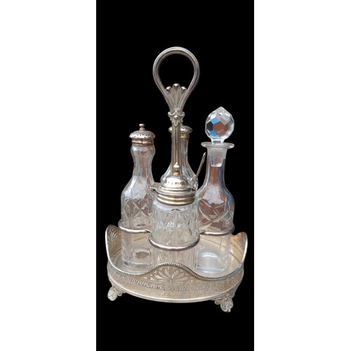A STUNNING VITORIAN IRISH SILVER TOPPED CONDIMENT SET ON AN ORNATE ...