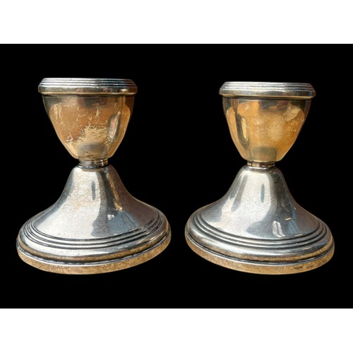 A PAIR OF BIRMINGHAM SILVER SHORT CANDLESTICKS