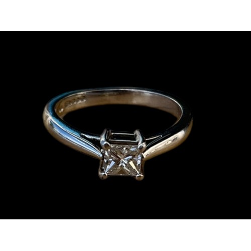 A 950 STAMPED PLATINUM AND DIAMOND RING