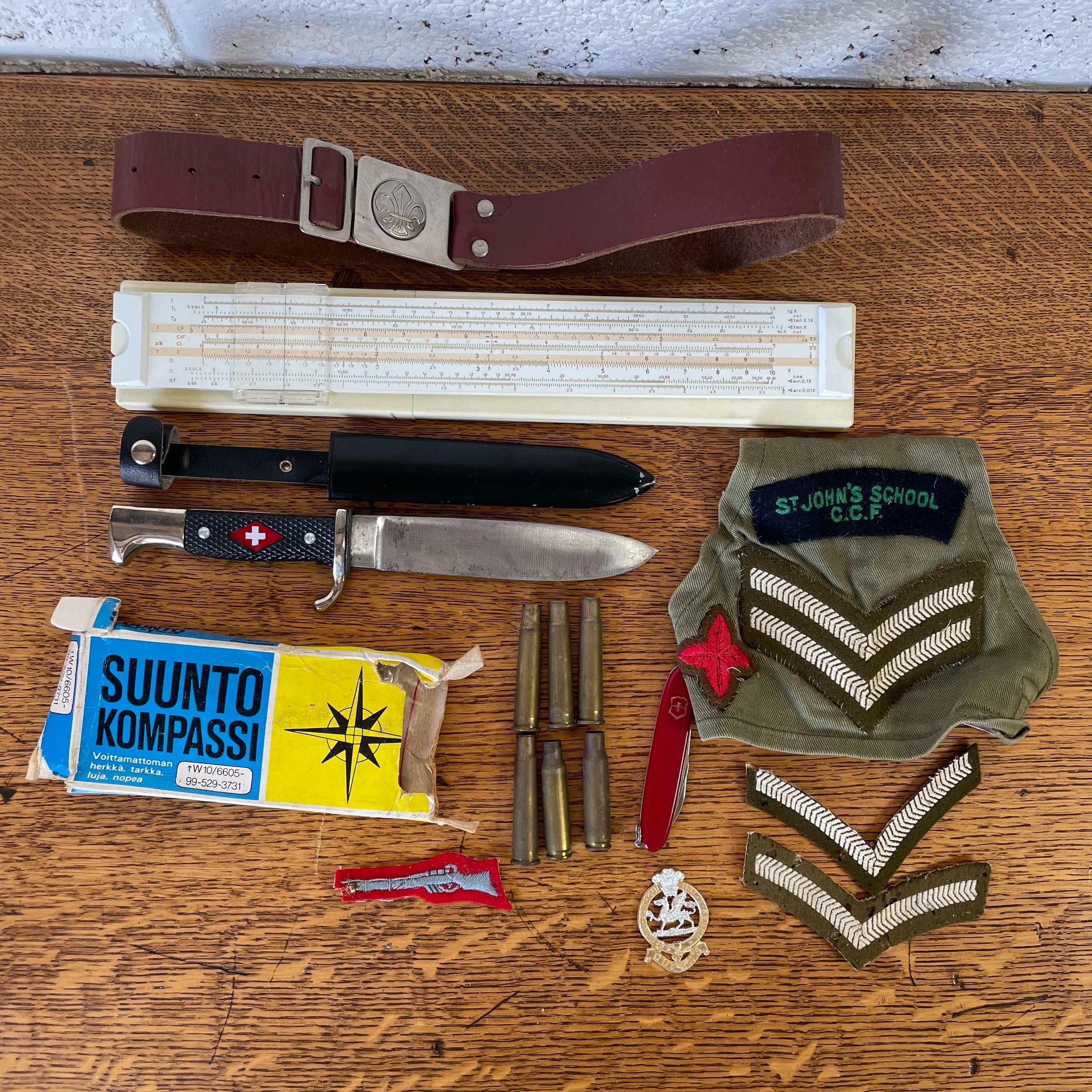 A Rummage Box Including Army Cadet Badges, A Belt, Knives, Shells and ...