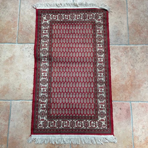 A Small Red Rug. Size: W:67cm x L:115cm