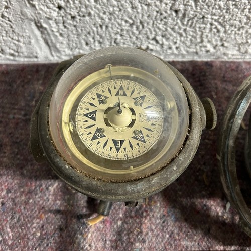 Two Small Ships Compasses. Size: Largest W:20cm D:20cm H:10cm.