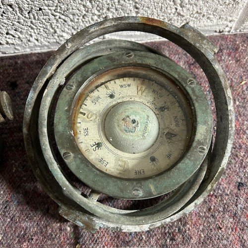 Two Small Ships Compasses. Size: Largest W:20cm D:20cm H:10cm.