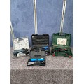 Four cordless battery powered tools including drills and a screwdriver.