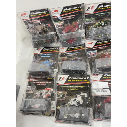 A group of 20 Panini F1 Car Collection Boxed Replica Models with Magazines