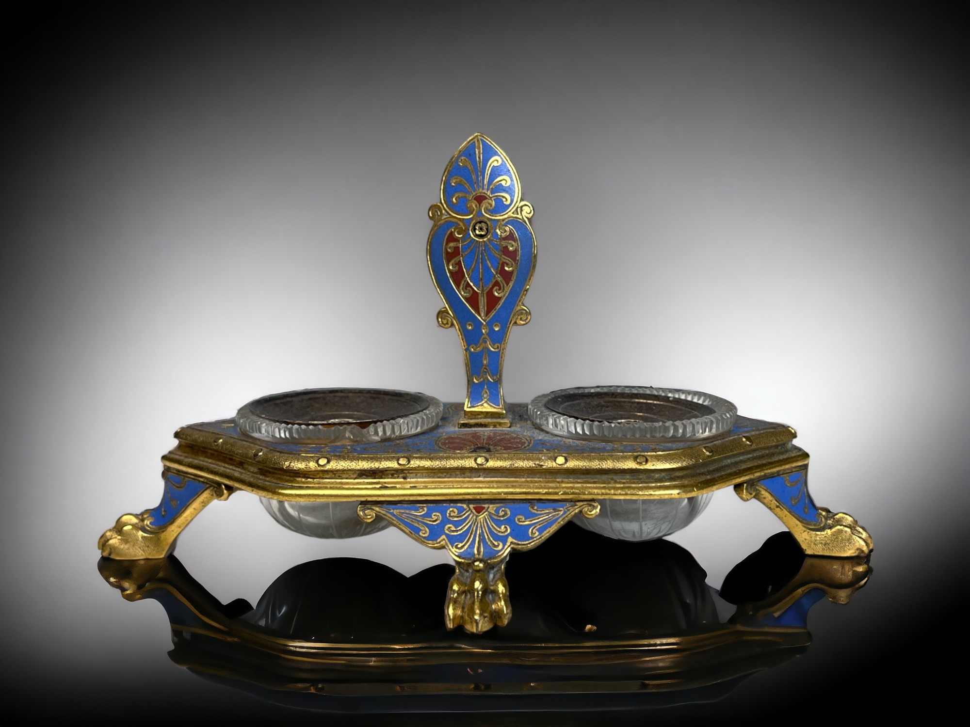 AN ELKINGTON ORMOLU & CHAMPLEVE ENAMEL INKSTAND. Raised on four ormolu ...