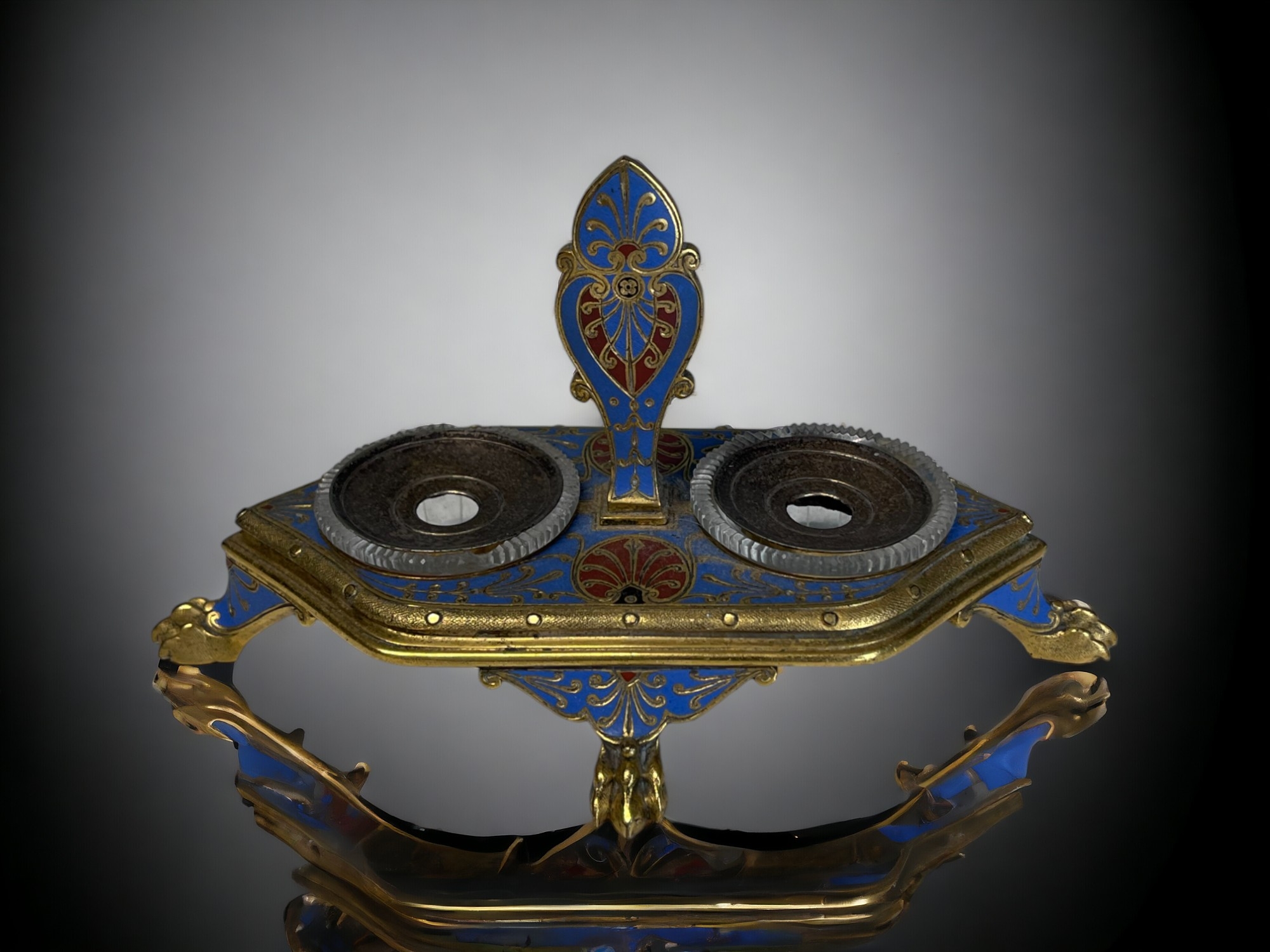 AN ELKINGTON ORMOLU & CHAMPLEVE ENAMEL INKSTAND. Raised on four ormolu ...