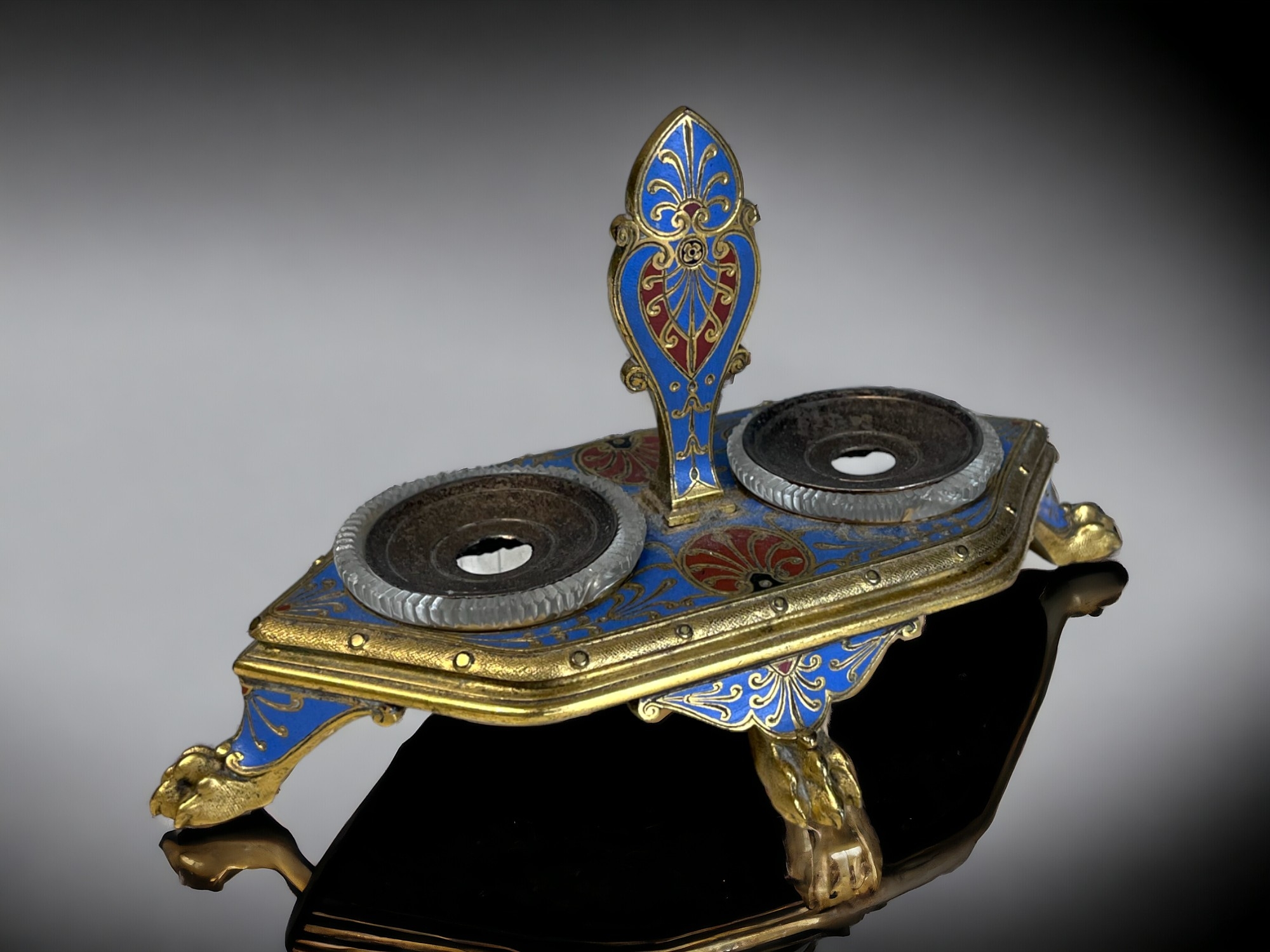 AN ELKINGTON ORMOLU & CHAMPLEVE ENAMEL INKSTAND. Raised on four ormolu ...