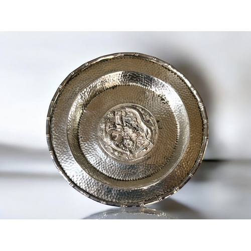 A collection of five silver coin dishes.Including Spanish Reales and ...