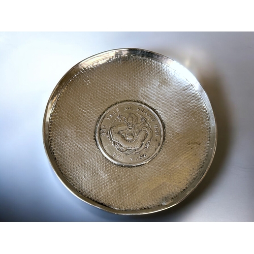 A collection of five silver coin dishes.Including Spanish Reales and ...