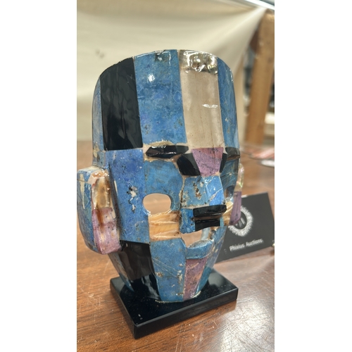 Inlaid stone mosaic mask, blue, lilac, black and shell tesserae over a ...