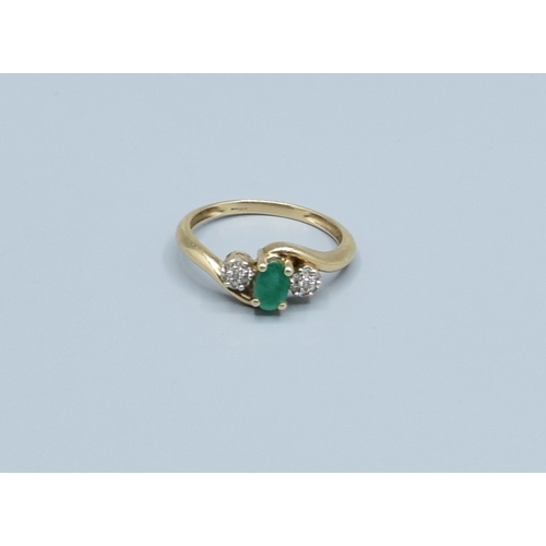 9ct gold ladies Emerald and Diamond ring in a sweep design size O, 2.5grams