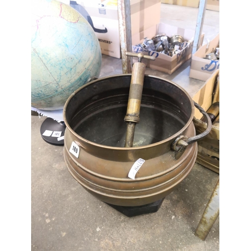 A copper cooking pot with swing handle