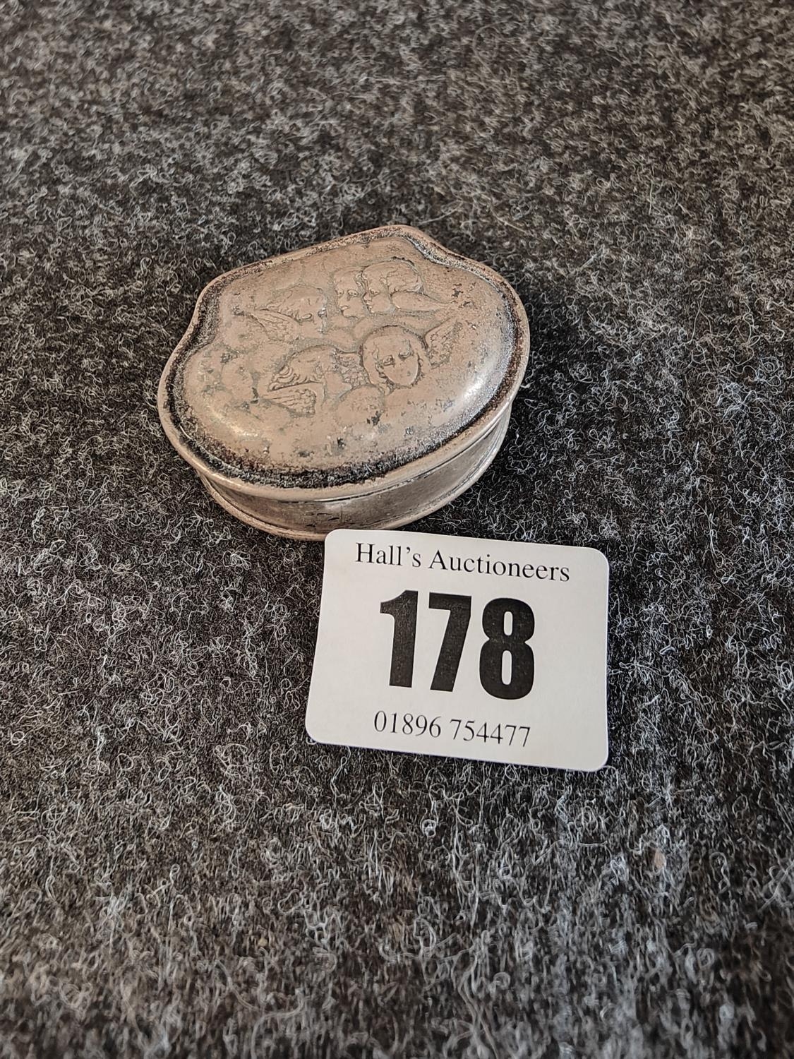 A silver trinket box, embossed with Angels, Sheffield 1904, 1 1/2" L