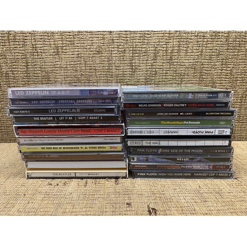 Collection of CDs including: The Beatles, Pink Floyd and Zed Zeppelin.