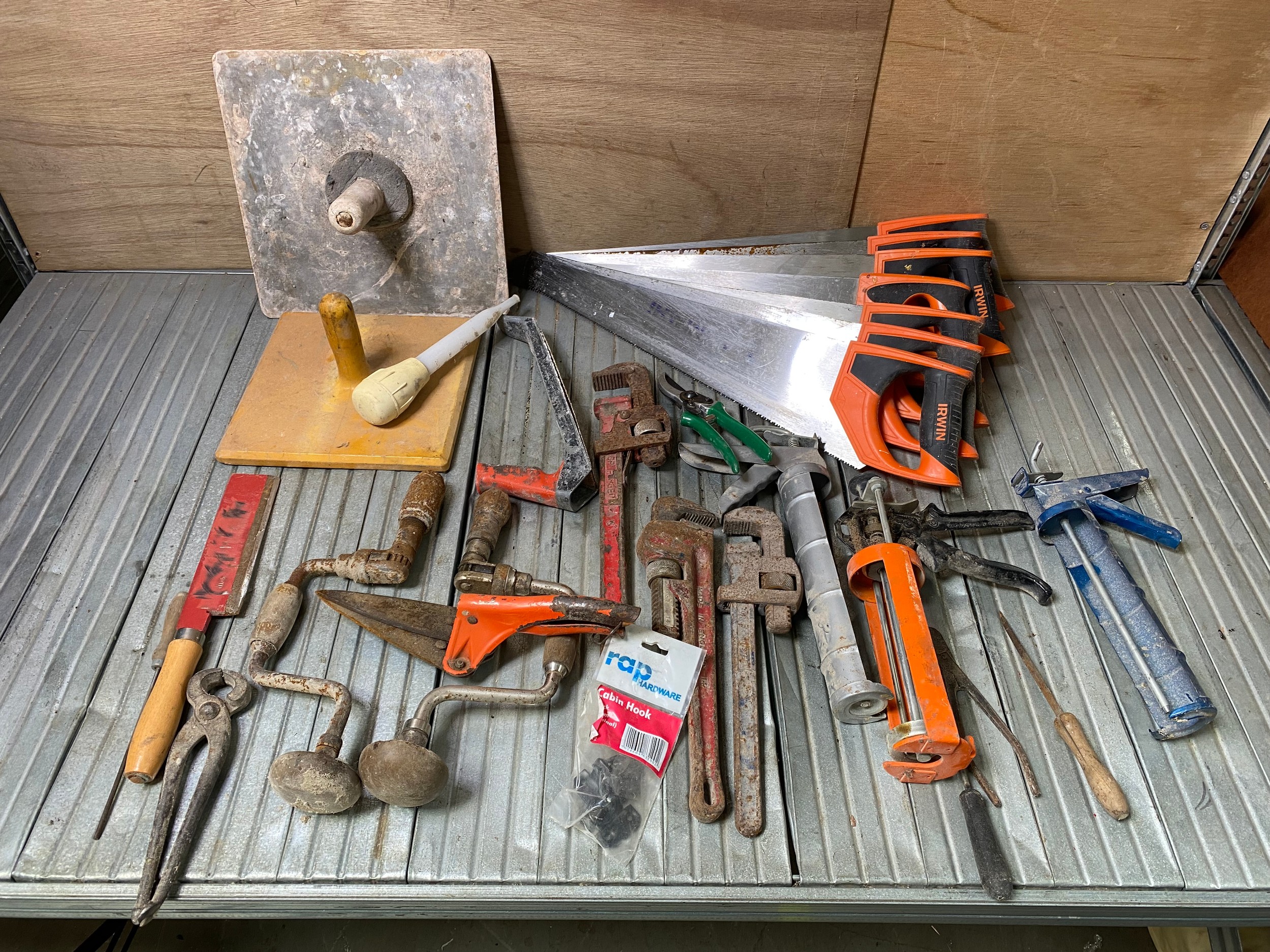 Selection of tools including: Saws, hand drills and stiltons.