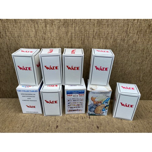 Selection of collectible Wade Ceramics figures with original boxes.